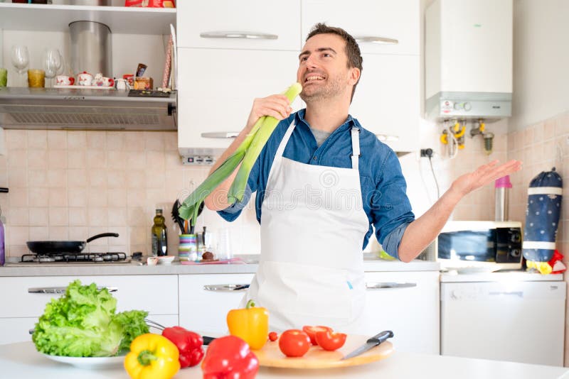 One Man is Singing in the Kitchen while Cooking Stock Image - Image of ...