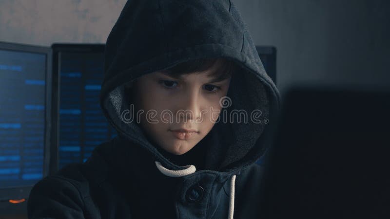 Portrait of a Genius Boy Hacker Prodigy in the Hood Working on Computer ...