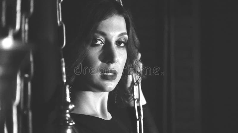 Portrait of a Girl on the Background of Chains in a Dark Room, Black ...