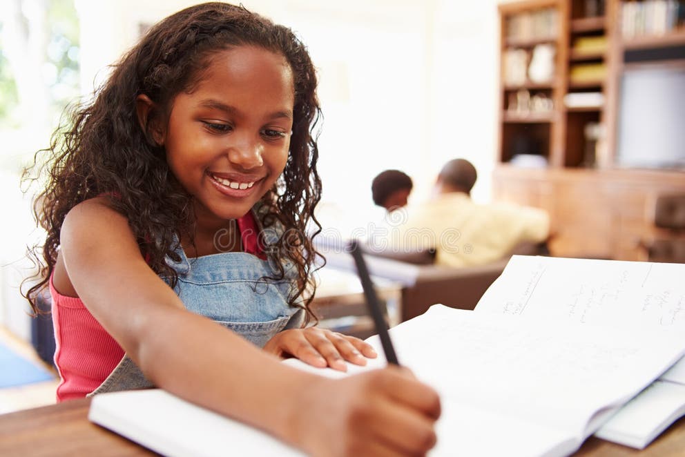 Portrait of Girl Doing Homework at Table Stock Image - Image of person ...