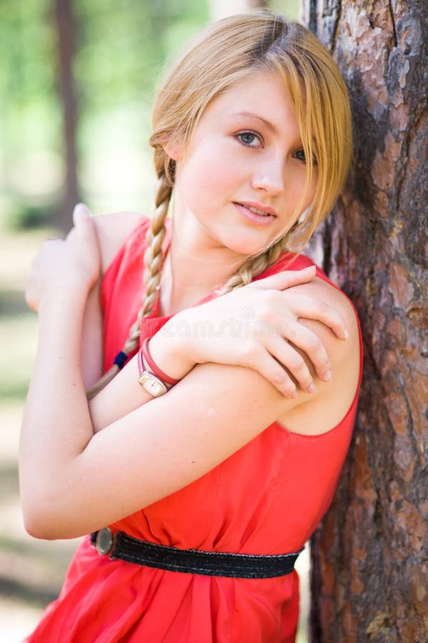 Girl posing near the tree stock photo. Image of looking - 11475310