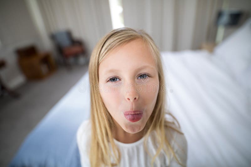 Girl Pouting Lips and Closed Eyes while Playing with Her Hair during ...