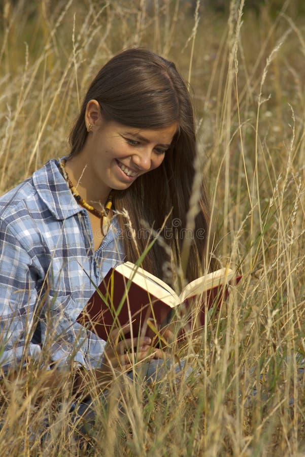 Portrait of Girl Reading a Book in the Grass Stock Image - Image of ...