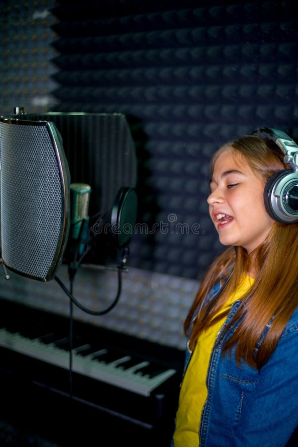 Girl in a recording studio stock image. Image of keyboard - 107244851