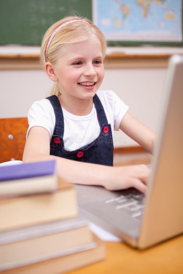Portrait of a Girl Using a Laptop Stock Photo - Image of learning ...