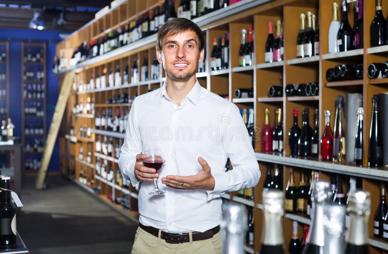 Portrait of Glad Male Customer Tasting Wine before Purchasing it Stock ...