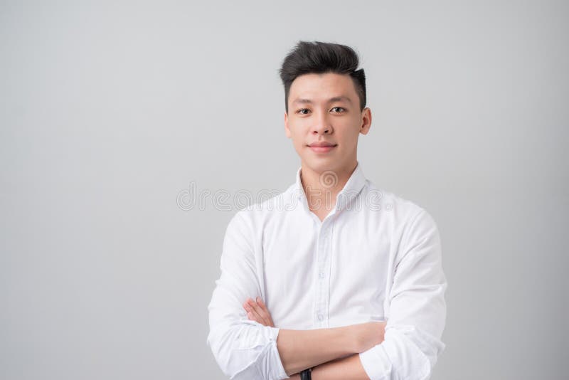 Portrait of Good Looking Asian Man Over Gray Background. Stock Image ...