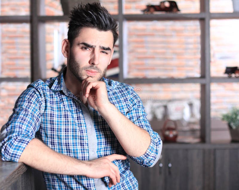 Good Looking Young Man in Full Suit Holding Laptop while Sitting in the ...