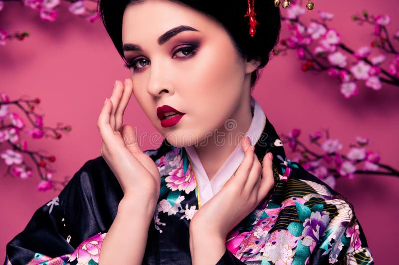 Portrait Of Gorgeous Asian Woman In Traditional Costume Showing Her
