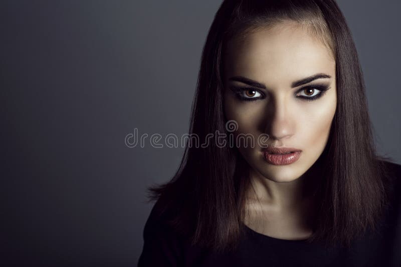 Portrait Of Gorgeous Dark Haired Young Woman With Provocative Make Up