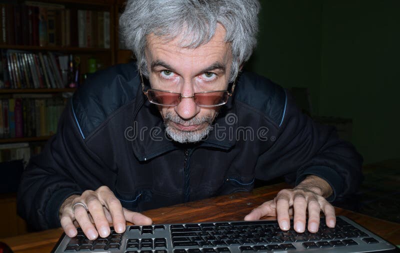 Portrait of a Gray-haired Man with a Computer Keyboard Stock Photo ...