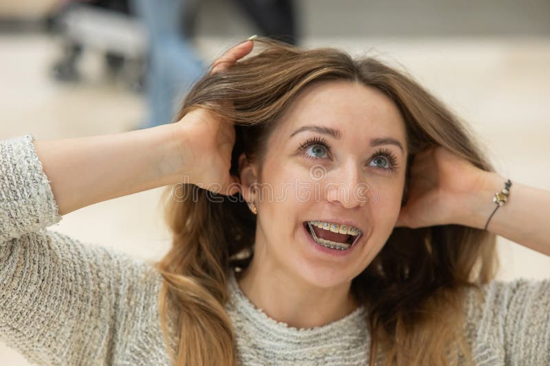 Portrait of a Grimacing Woman with Braces on Her Teeth. Stock Image ...