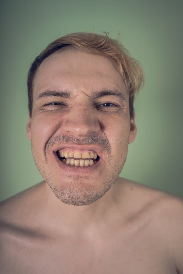 Guy shows his teeth stock photo. Image of anxiety, concept - 122350976