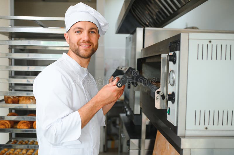 Portrait of Handsome Baker at the Bakery with Breads and Oven on the ...