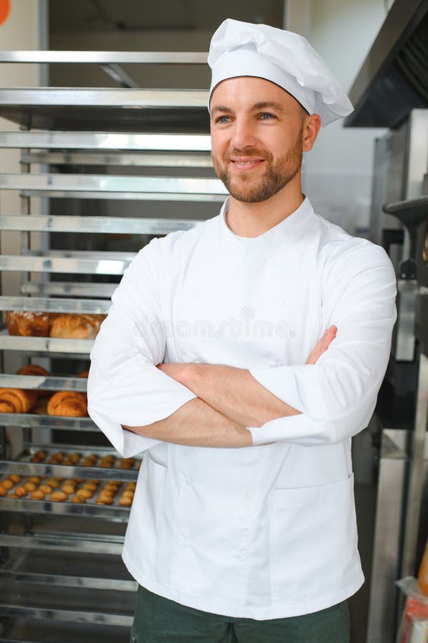 Portrait of Handsome Baker at the Bakery with Breads and Oven on the ...