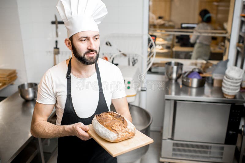 Baker with Bread in the Bakery Stock Photo - Image of loaf, rustic ...