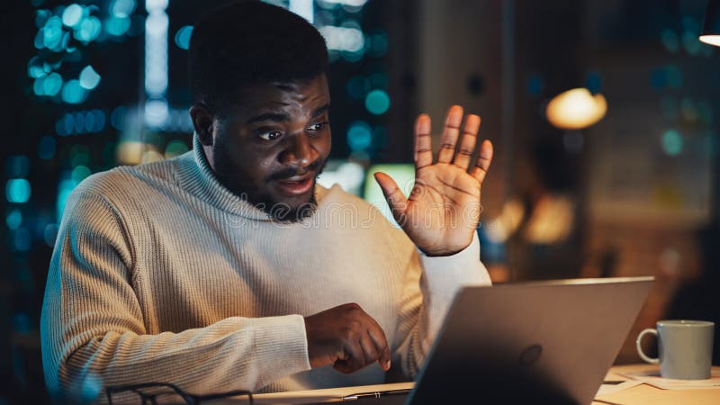 Portrait of a Handsome Black Project Manager Making a Video Call on ...