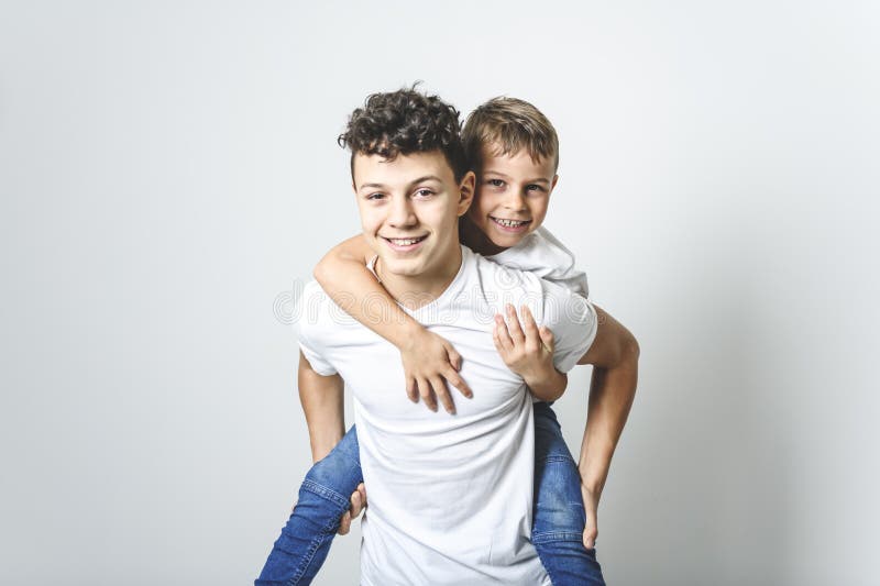 Portrait of Handsome Brother Posing Near the White Wall Stock Photo ...
