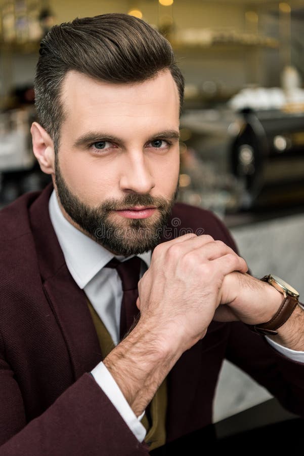 Portrait of Handsome Businessman in Formal Wear with Folded Hands ... Portrait of Handsome Businessman in Formal Wear with Folded Hands ...