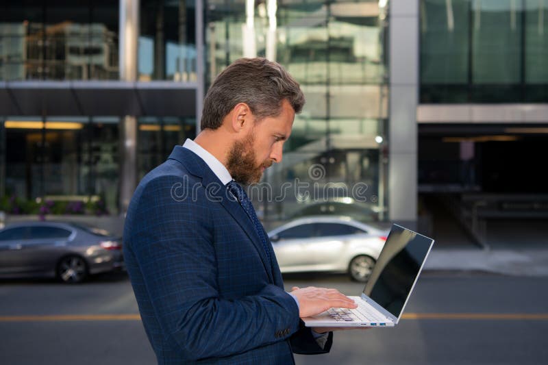 Portrait of Handsome Businessman Using Laptop Outdoor. Stock Image ...