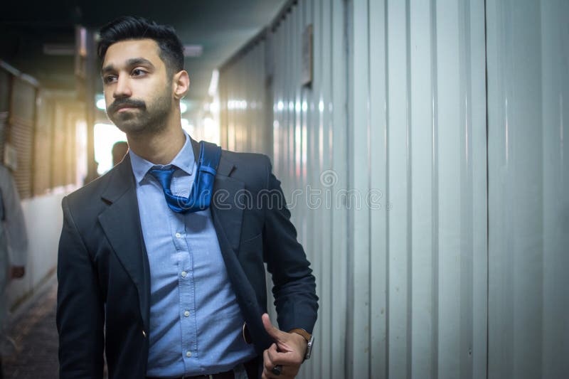 Portrait of Handsome Businessman Walking through Building Under ...