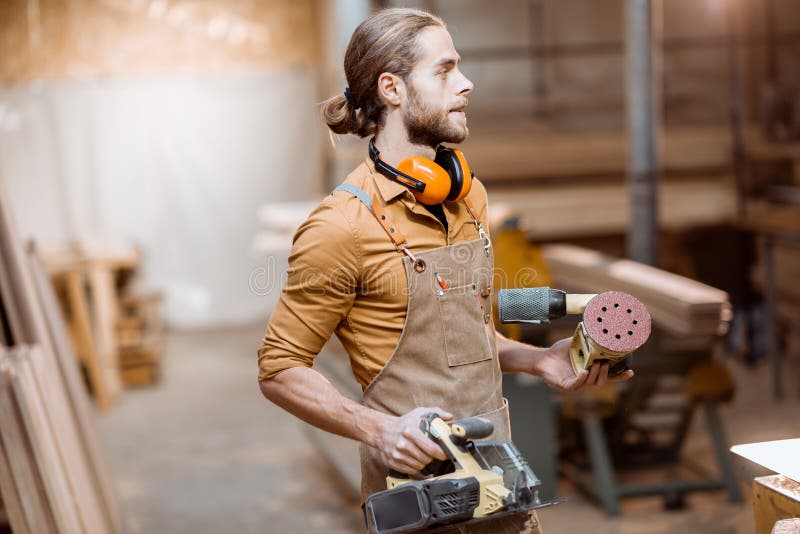 Carpenter with Modern Tools at the Workshop Stock Image - Image of ...