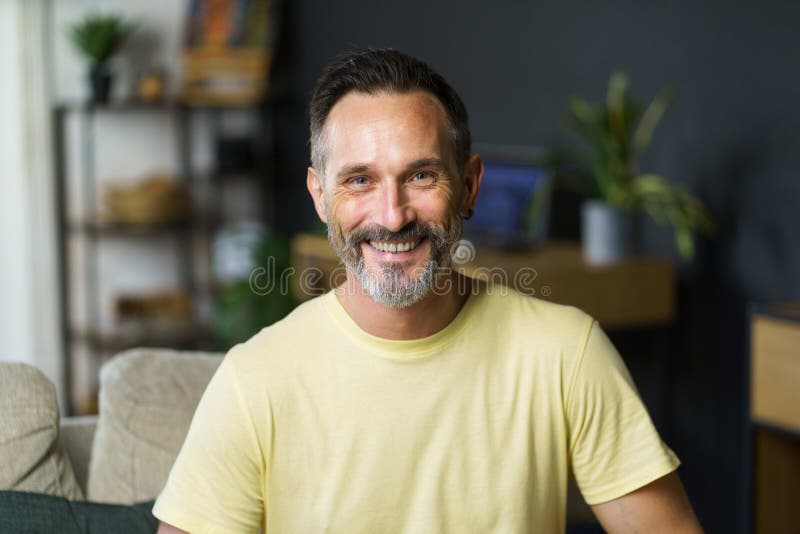 Portrait Of Handsome Cheerful Grey Haired Middle Aged Freelancer Man