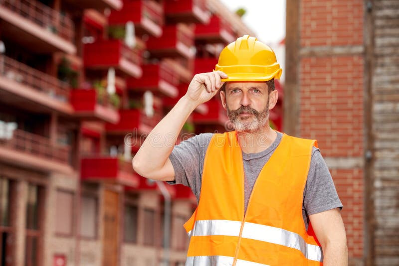 Handsome Construction Worker with Yellow Helmet at Construction Site ...
