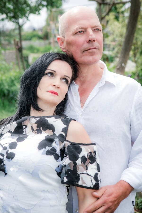 Portrait of Handsome Couple in Their 50s Standing Outdoors in Nature ...