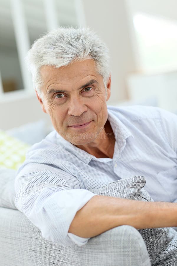Portrait of Handsome Elderly Man Relaxing in Sofa Stock Image - Image ...