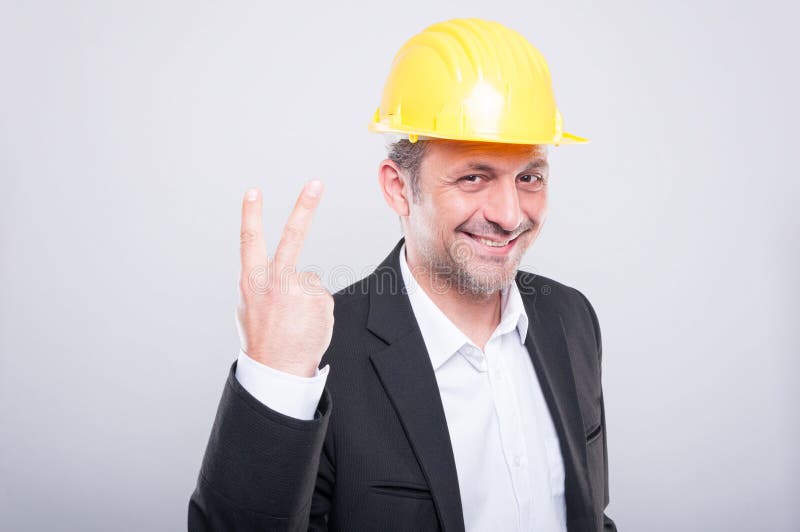 Portrait of Handsome Engineer Showing Number Two Gesture Stock Photo ...