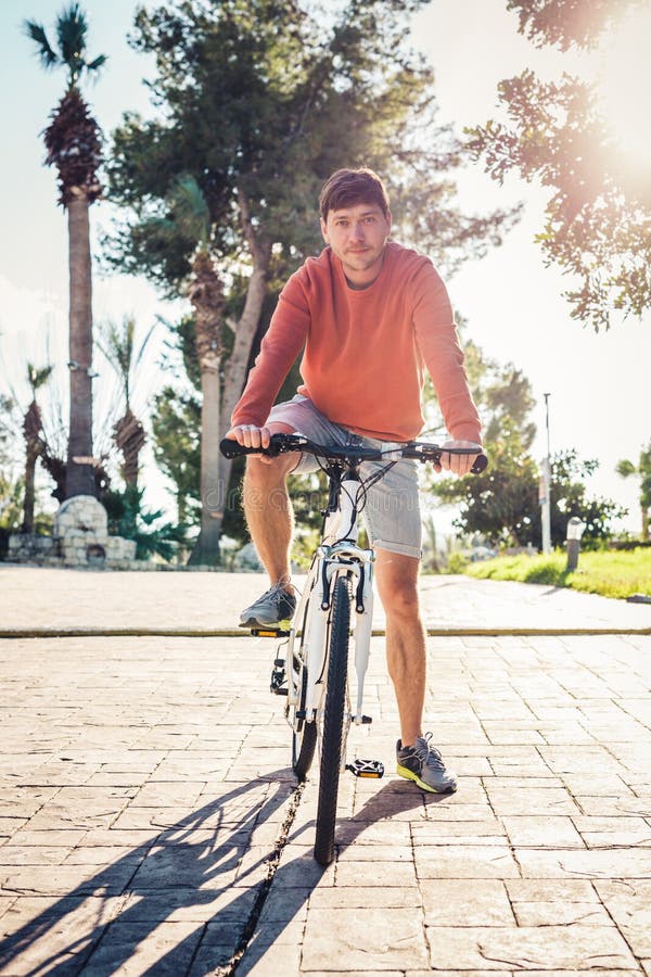Portrait of Handsome Guy Riding Bicycle in the Park Stock Image - Image ...