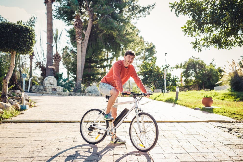 Portrait of Handsome Guy Riding Bicycle in the Park Stock Photo - Image ...