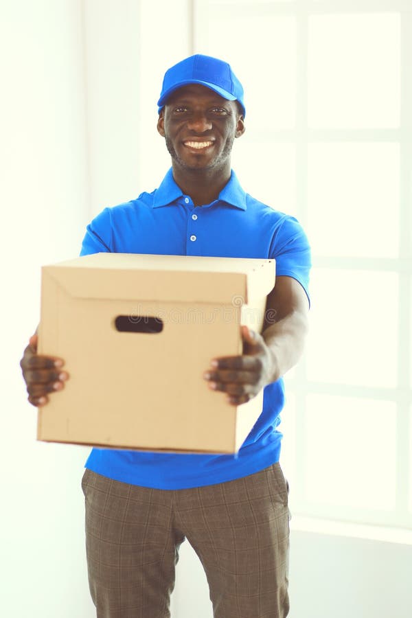 Portrait of an Handsome Happy Deliverer with Box Stock Photo - Image of ...