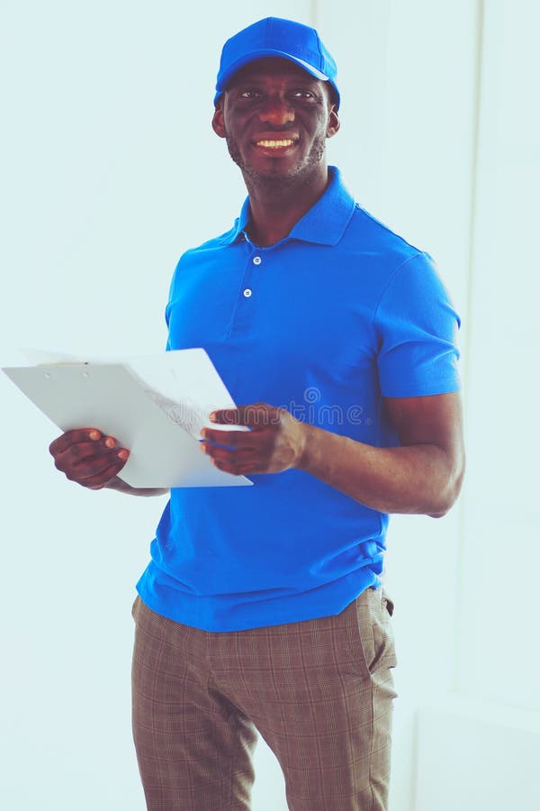 Portrait of an Handsome Happy Deliverer with Folder Stock Photo - Image ...