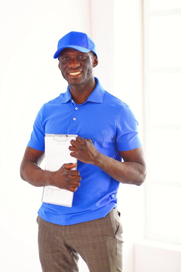 Portrait of an Handsome Happy Deliverer with Folder Stock Image - Image ...