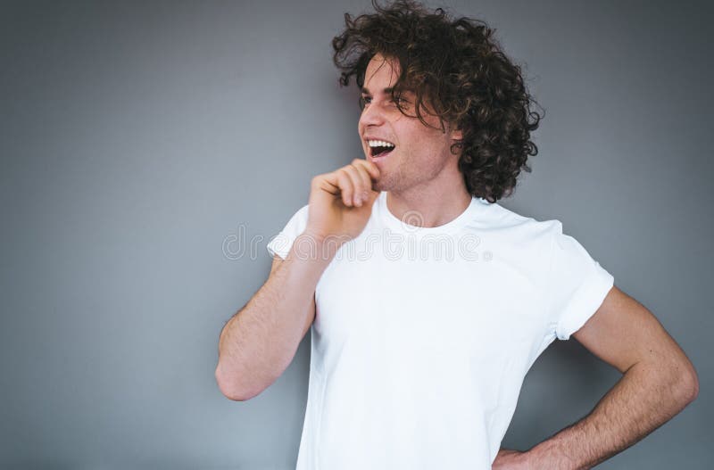 Portrait Of Handsome Curly Hair Male Shows Refusal And Stop Gesture