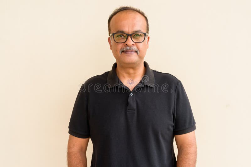 Portrait of Handsome Indian Man with Mustache Against Plain Wall Stock ...