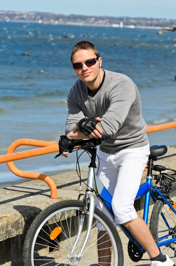 Portrait of Handsome Male with Bicycle Stock Photo - Image of shore ...