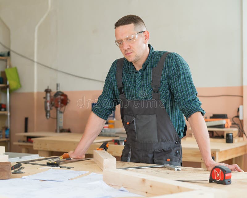 Portrait of a Handsome Male Carpenter in the Workshop. Stock Photo ...