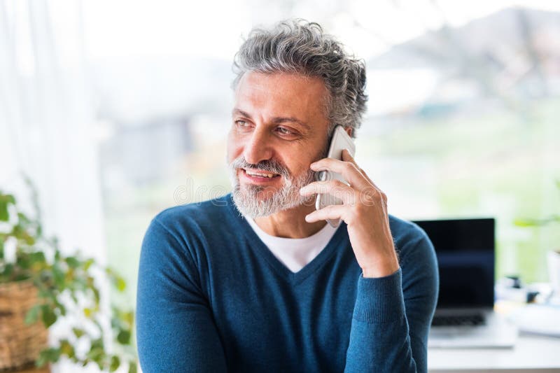 Portrait of Handsome Man Making Phone Call, Looking Out of Window and ...