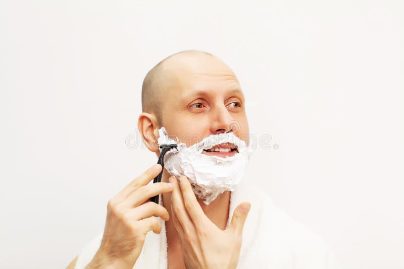 Portrait of Handsome Man Shaving Using a Razor and Looking Away Stock ...