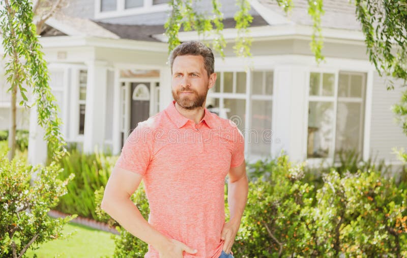 Portrait of Handsome Man Standing Outside New Home. Stock Image - Image ...