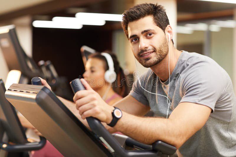Handsome Man Using Exercise Bike in Gym Stock Image - Image of people ...