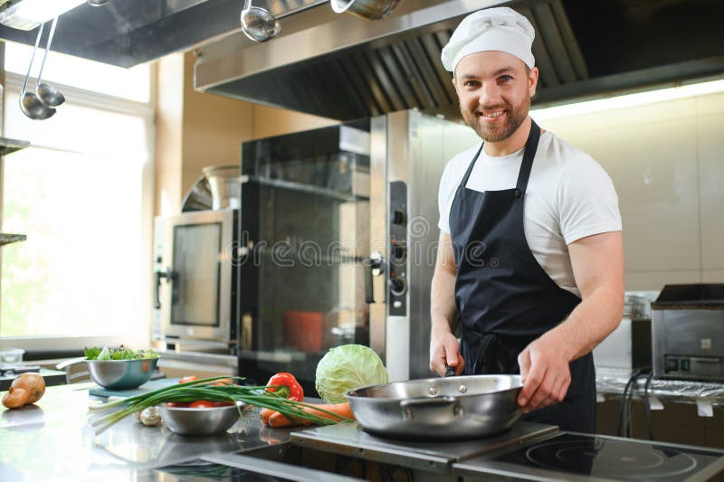 Portrait of Handsome Positive Chef Cook at the Restaurant Kitchen Stock ...