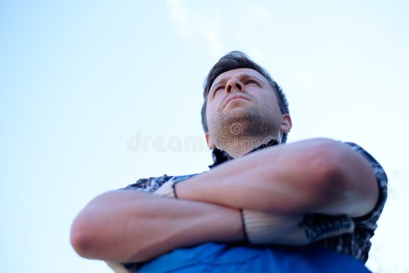 Portrait of Handsome Serious Young Man with Crossed Hands. Stock Photo ...