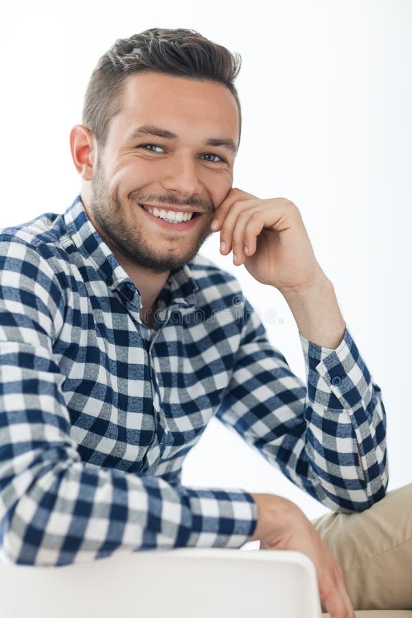 Handsome Smiling Man Relaxing on Window Sill Stock Photo - Image of ...