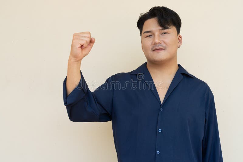 Portrait of Handsome Young Asian Man Against Plain Background Stock ...