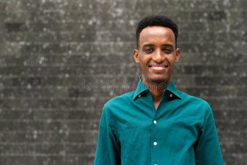 Portrait of Handsome Young Black Man Outdoors in City Stock Photo ...