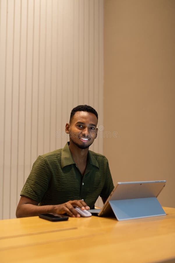 Portrait of Handsome Young Black Man Using Laptop Computer in Coffee ...